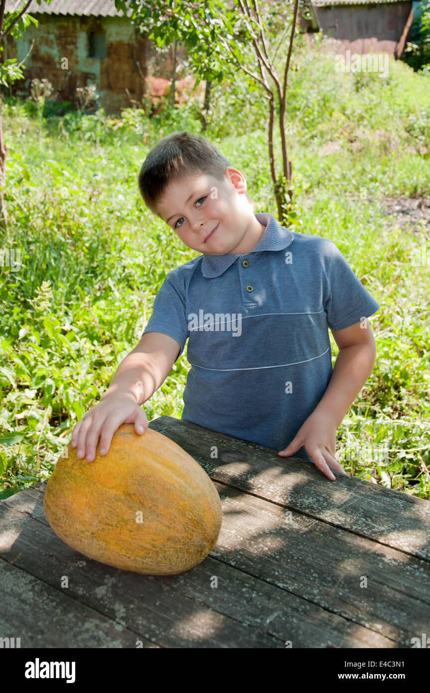 boy child melon crops eating sitting alone holds day sunny portrait big ...