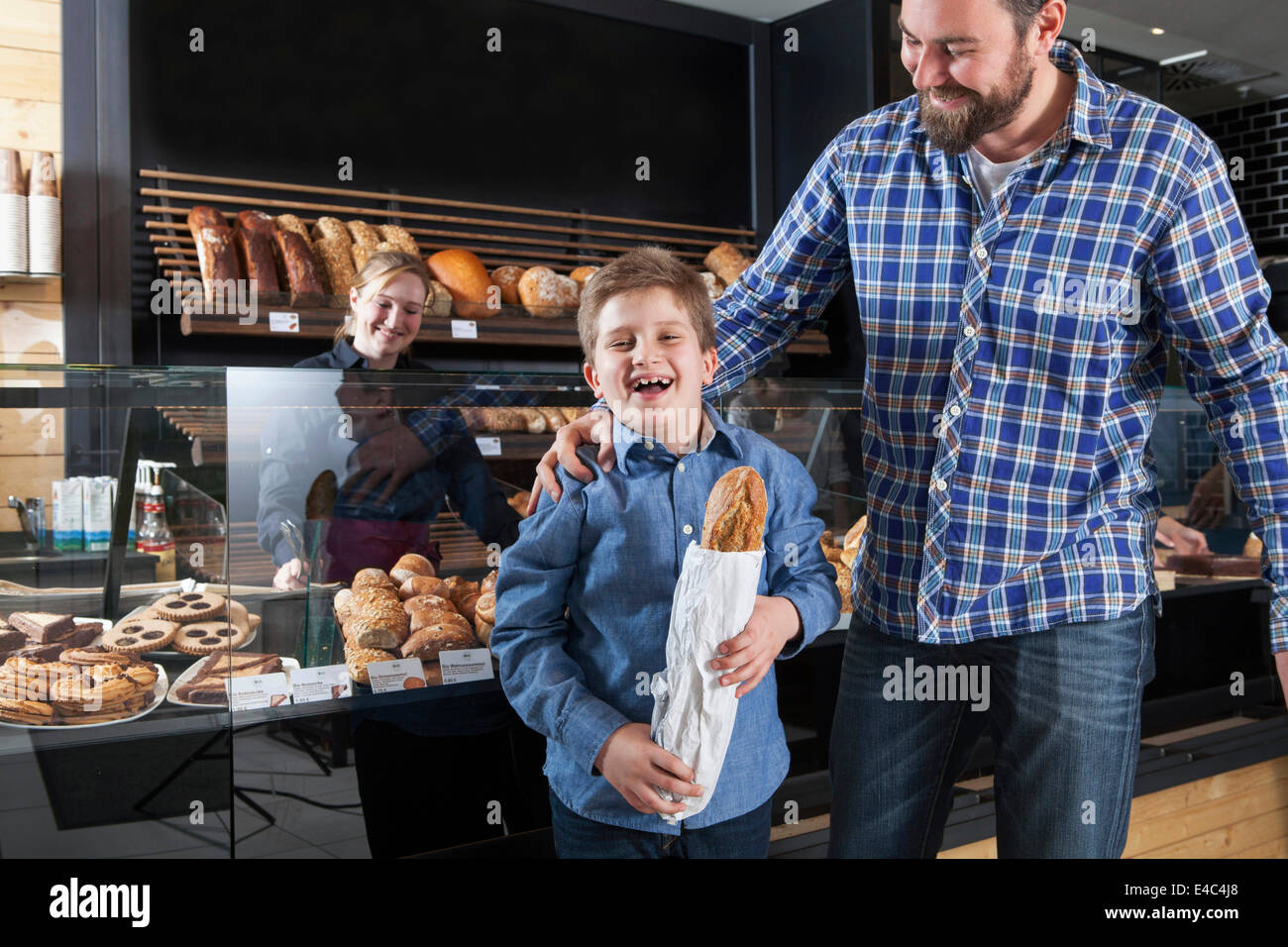 Father and son buying bread in a bakery Stock Photo - Alamy