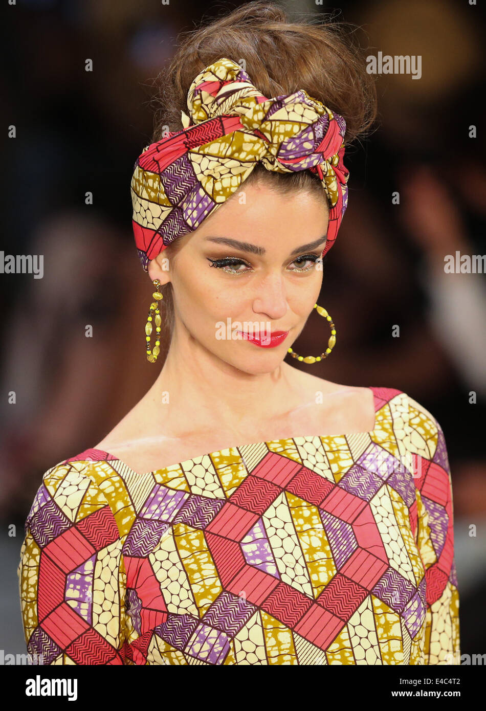 Berlin, Germany. 8th July, 2014. A model displays a creation by ...