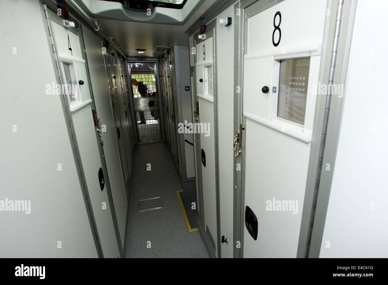 A judicial officer walks through the new bus for prisoner transports at ...