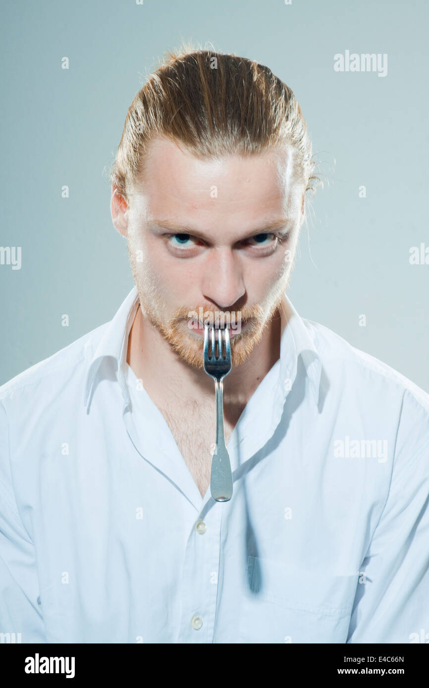 humorous man with fork Stock Photo - Alamy