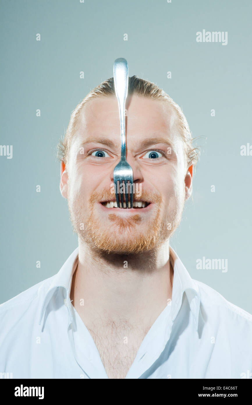 humorous man with fork Stock Photo - Alamy