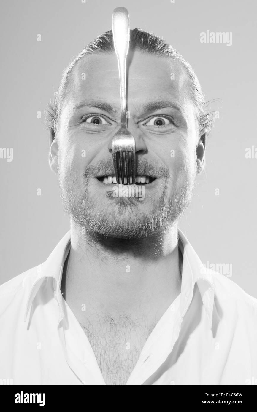 humorous man with fork Stock Photo - Alamy