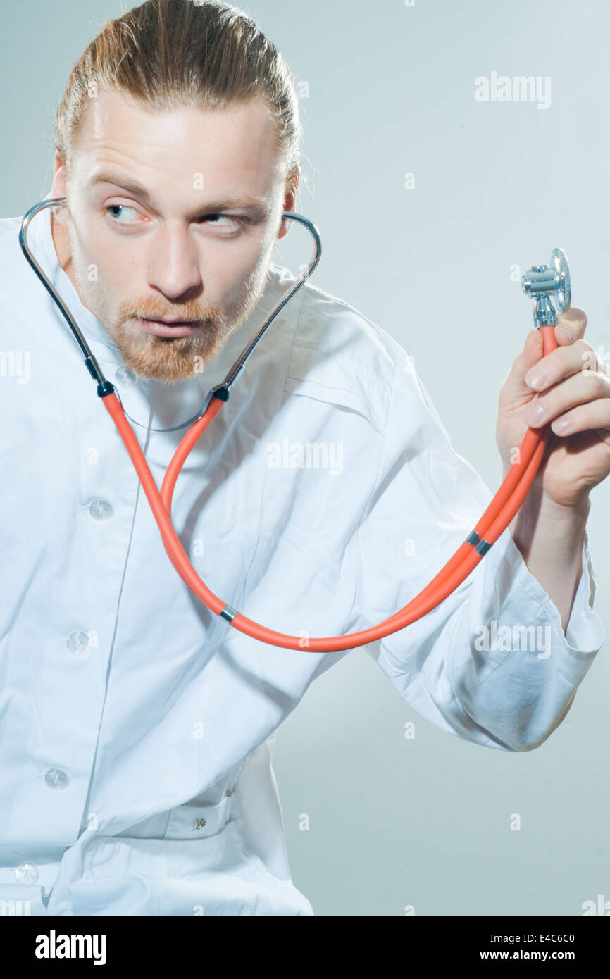 funny young man with stethoscope Stock Photo - Alamy