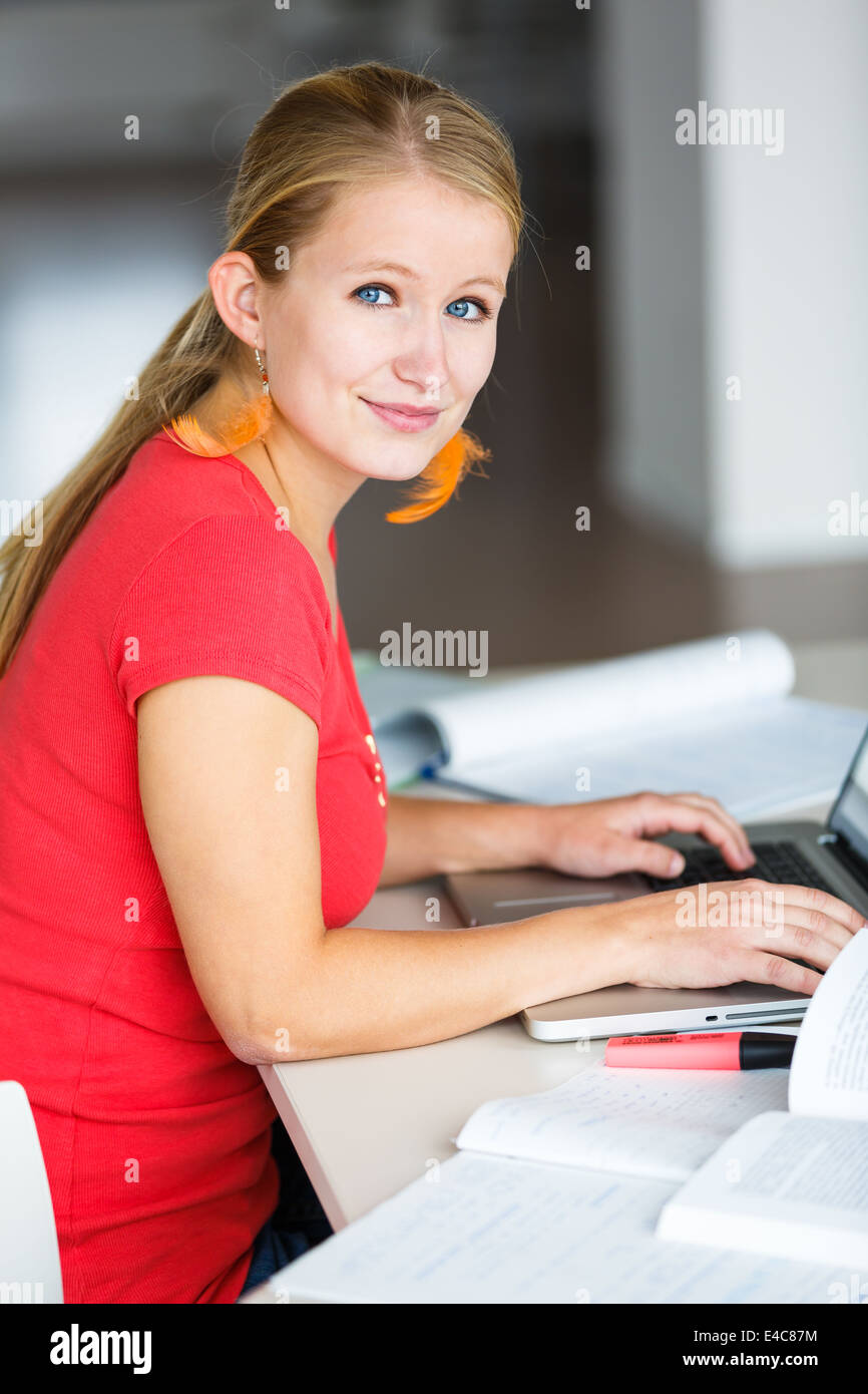 Pretty, female college student in a library Stock Photo - Alamy