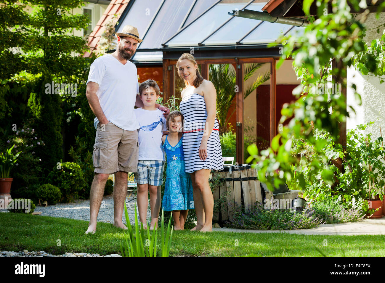 Family with two children in front of their home, Munich, Bavaria ...