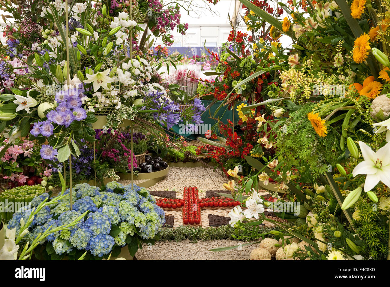 Hampton Court, UK. 8th July, 2014. Waitrose display witha a flag made ...