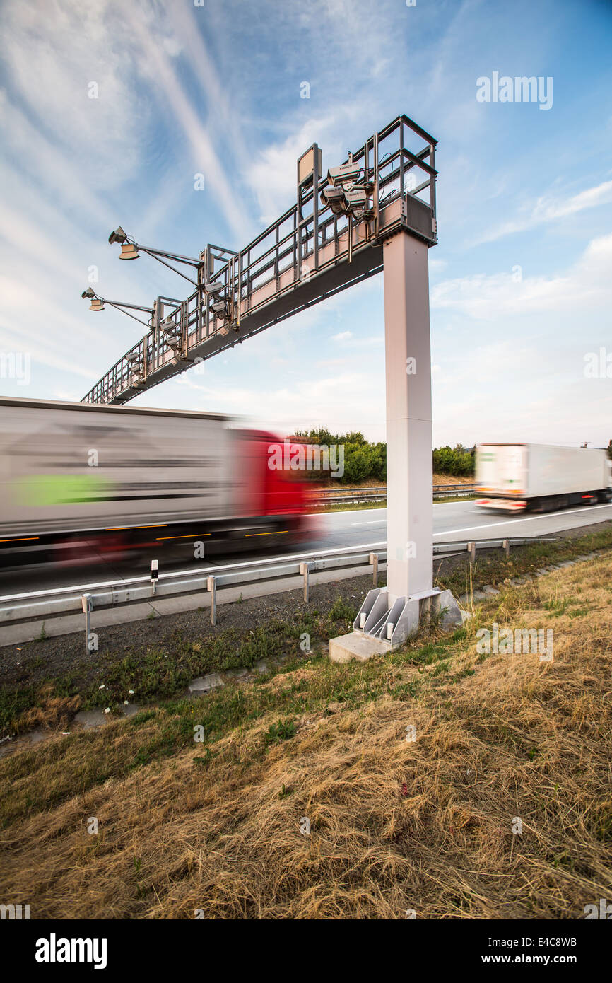 truck passing through a toll gate on a highway (motion blurred image ...