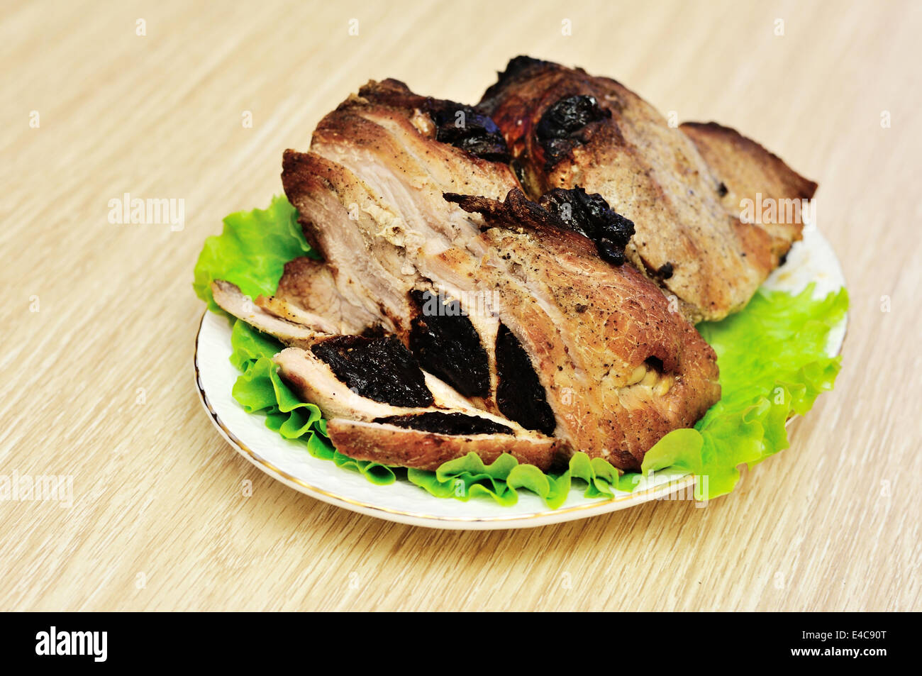 Meat baked with prunes Stock Photo - Alamy