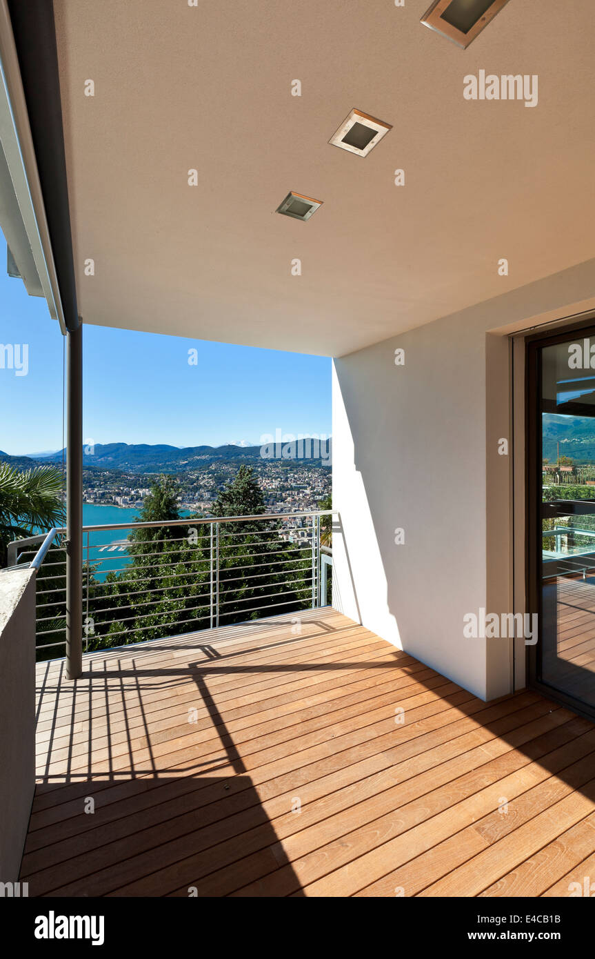 Modern apartment, balcony overlooking the lake Stock Photo - Alamy