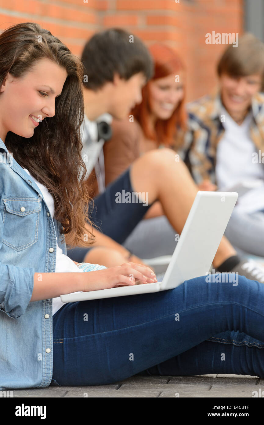 Girls talking outside with laptop High Resolution Stock Photography and ...