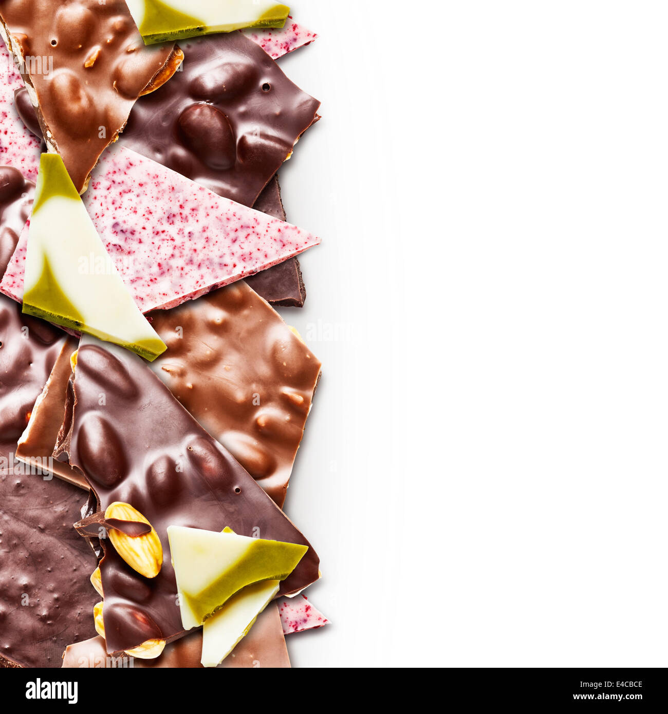 Assorted chocolate pieces border on white background Stock Photo - Alamy