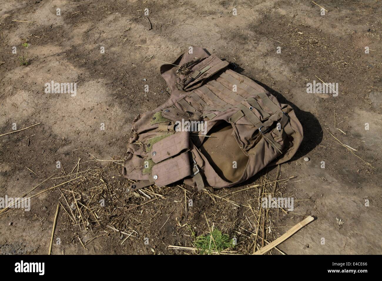 Pieces of Iraqi army gear litter the ground surrounding the checkpoint ...