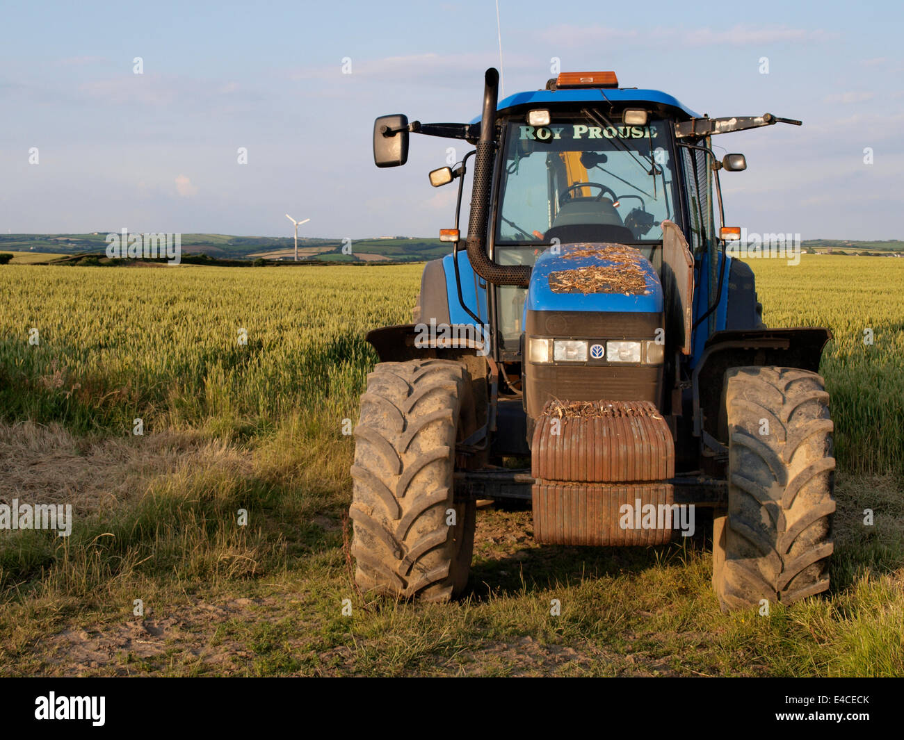 Tractor at the entrance to a field of wheat, Cornwall, UK Stock Photo ...