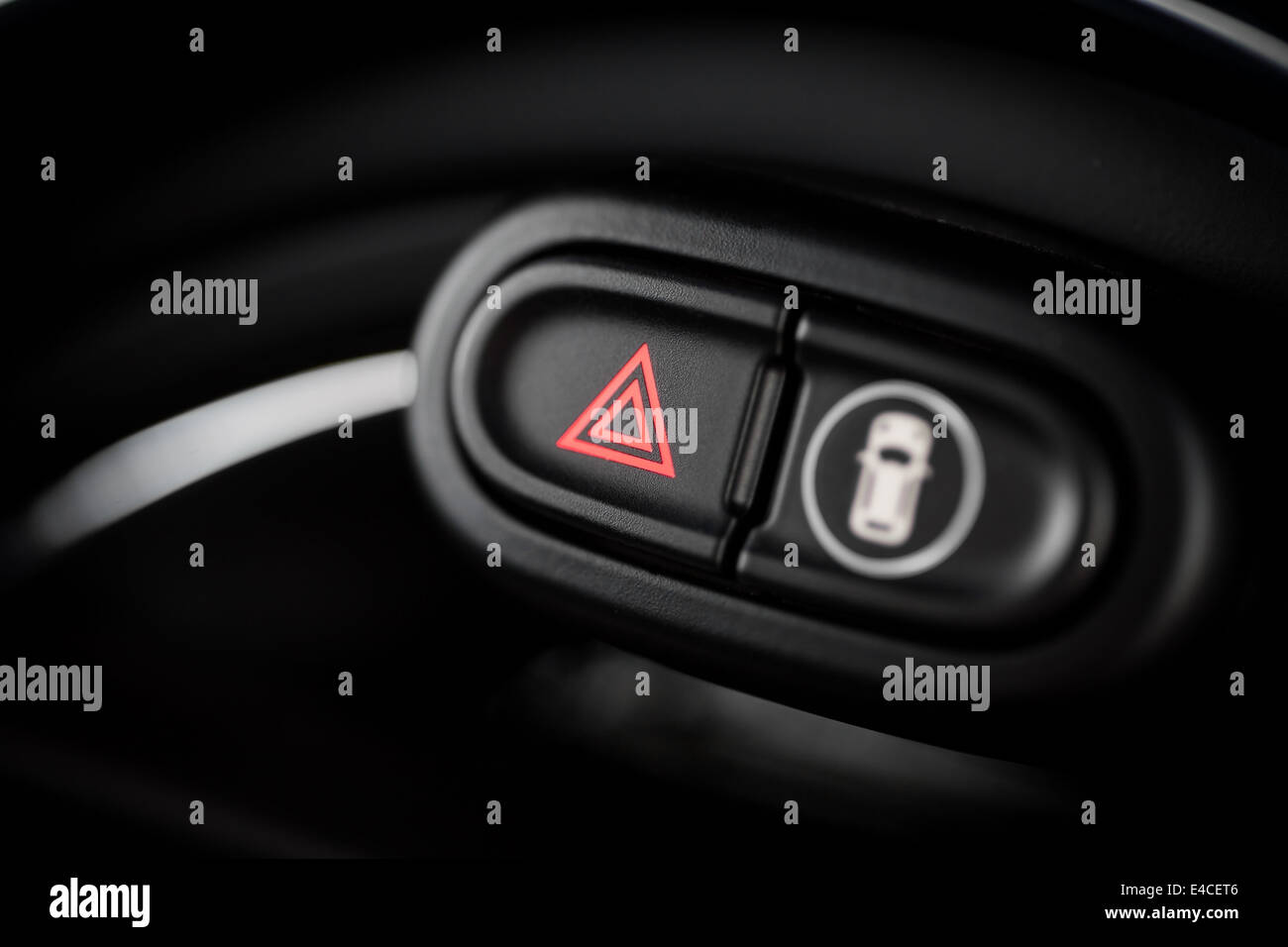Detail of a warning button in a car Stock Photo - Alamy