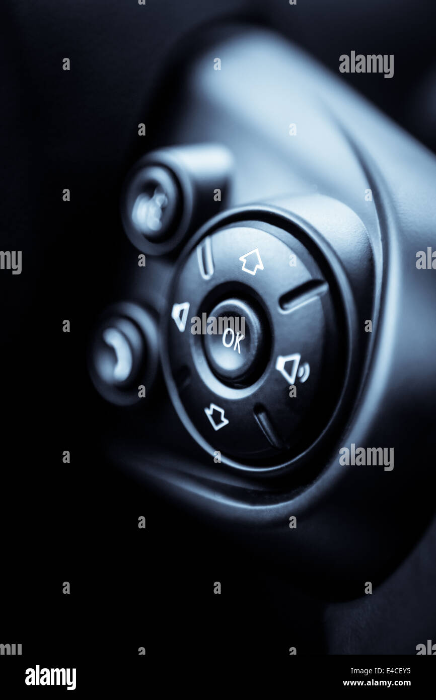 Detail on some buttons on a steering wheel Stock Photo - Alamy