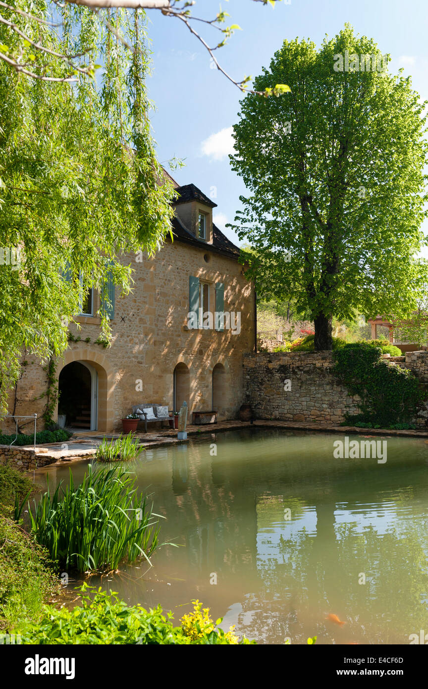 Exterior facade of a french mill and mill pond Stock Photo - Alamy