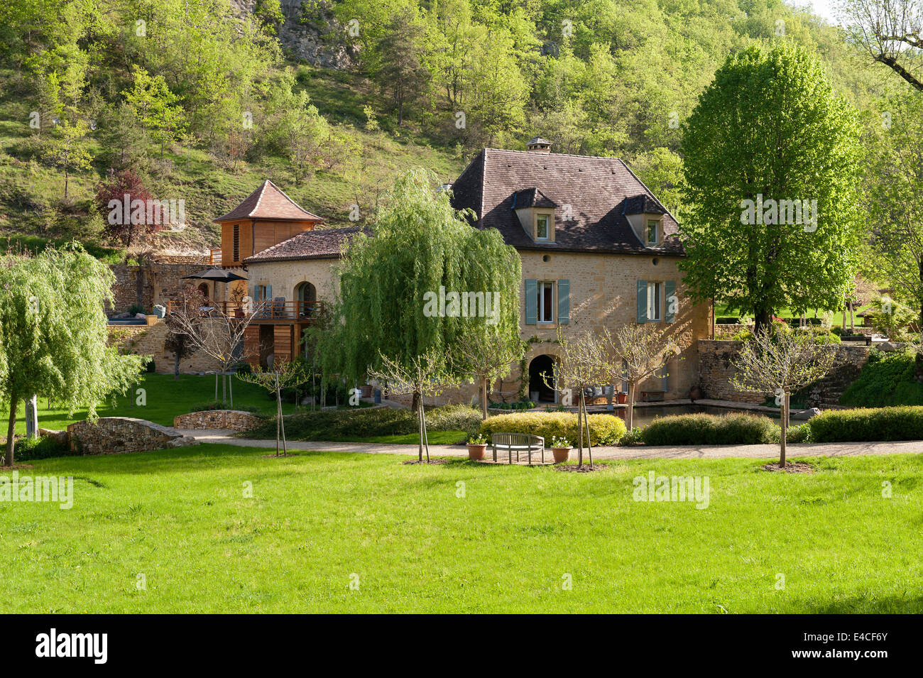 Exterior facade of a 17th century french mill framed by a backdrop of ...