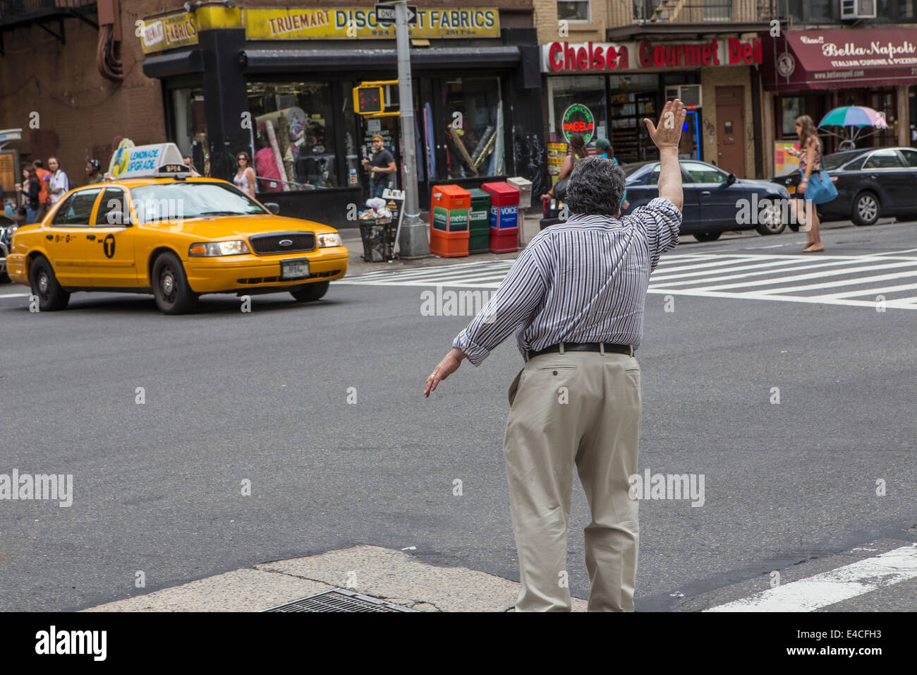 A man hails a taxi in the New York City borough of Manhattan, NY Stock ...