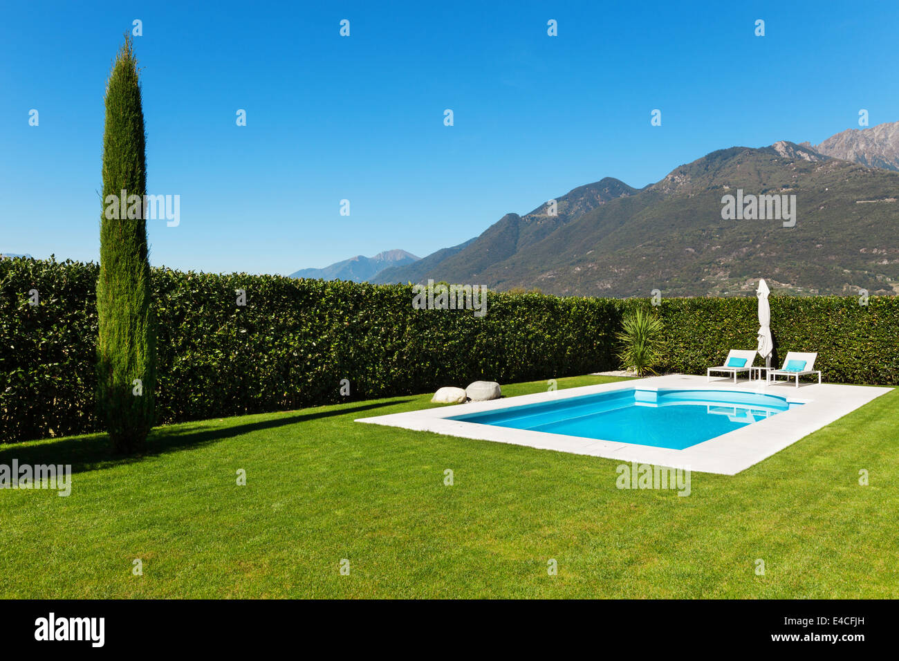 Modern villa with pool, view from the garden Stock Photo - Alamy