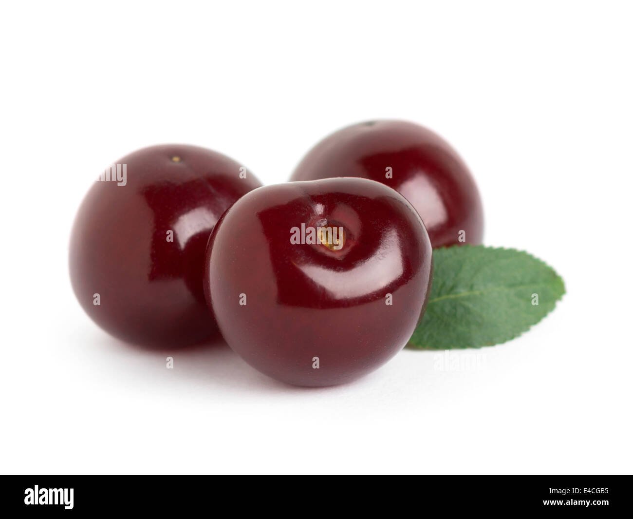 Sweet ripe three cherry on white background Stock Photo - Alamy