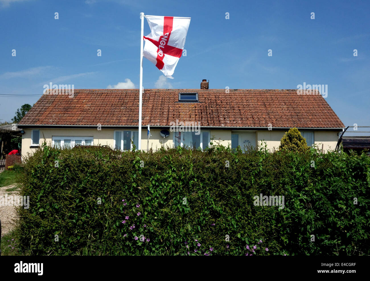England flag flying outside home in rural Somerset, England Stock Photo ...
