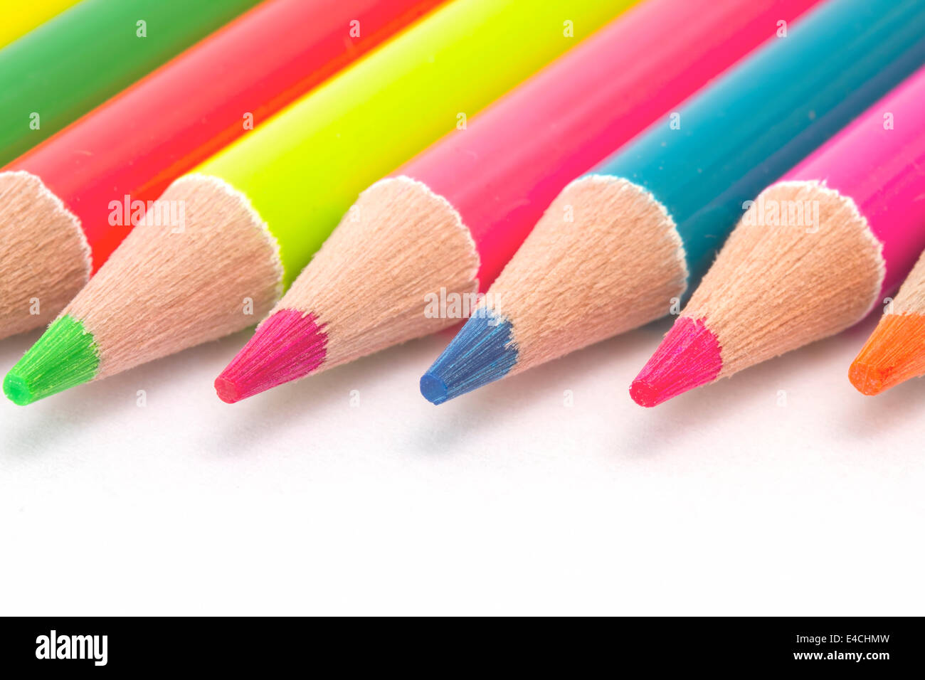 Close up bright color pencils on white paper Stock Photo - Alamy