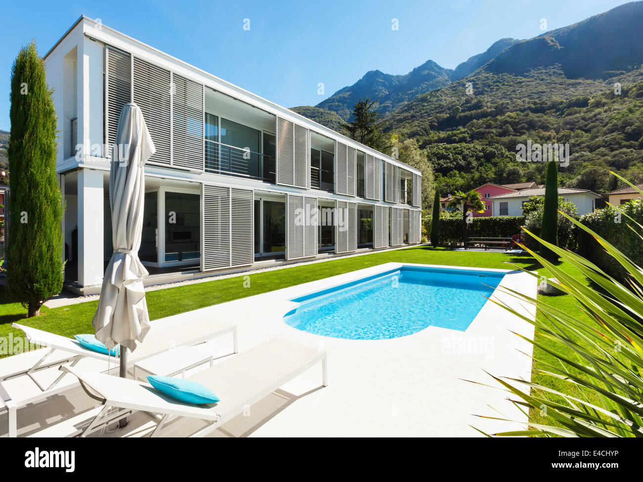 Modern villa with pool, view from the garden Stock Photo - Alamy