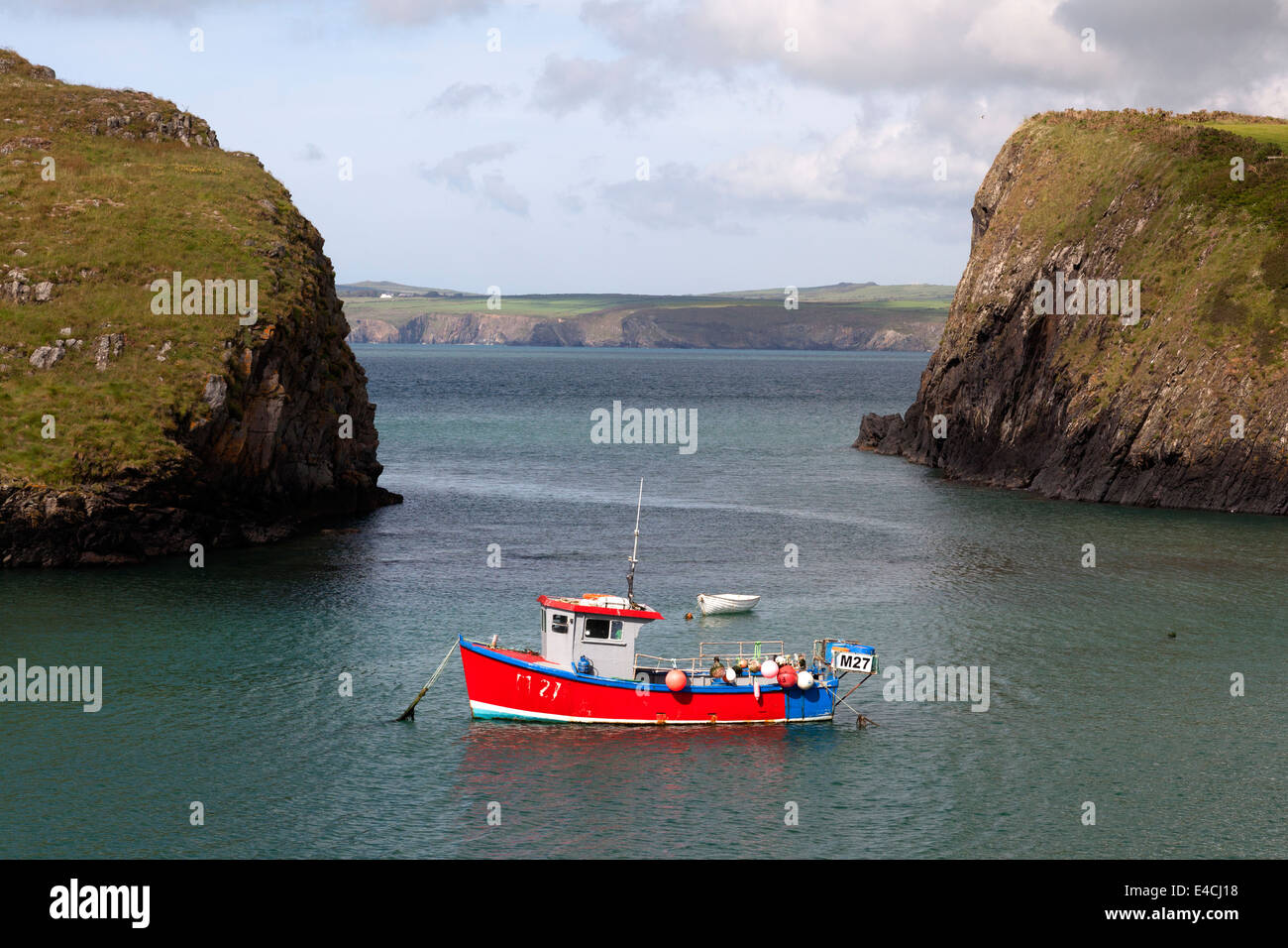 Fishing boat anchored in the harbour, Abercastle, Pembrokeshire Stock ...
