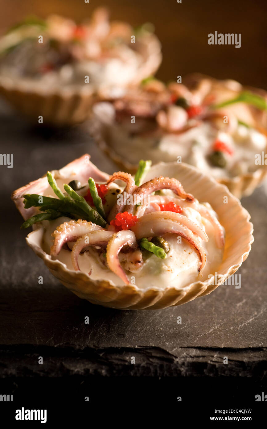Octopus on oyster shell Stock Photo - Alamy