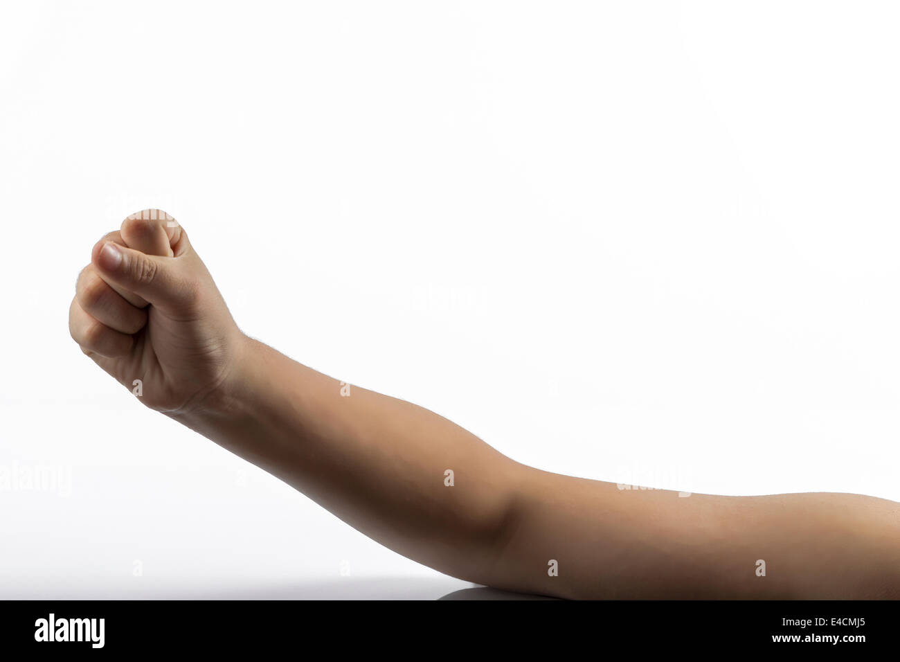 Young hands makes a gesture in rock-paper-scissors game: rock sign ...