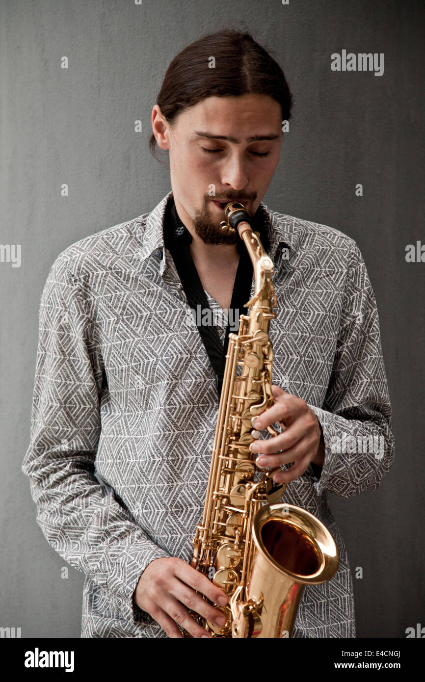 Saxophone playing hi-res stock photography and images - Alamy