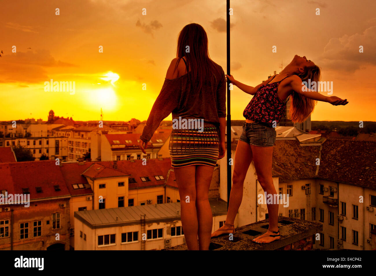 Women rooftop dramatic hi-res stock photography and images - Alamy