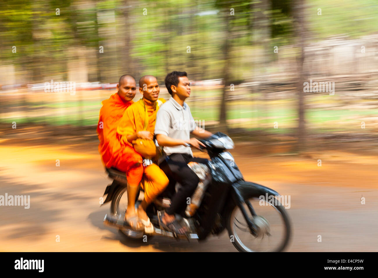 Monks speed on a motorbike, Angkor temple complex, Angkor Wat, Siem ...