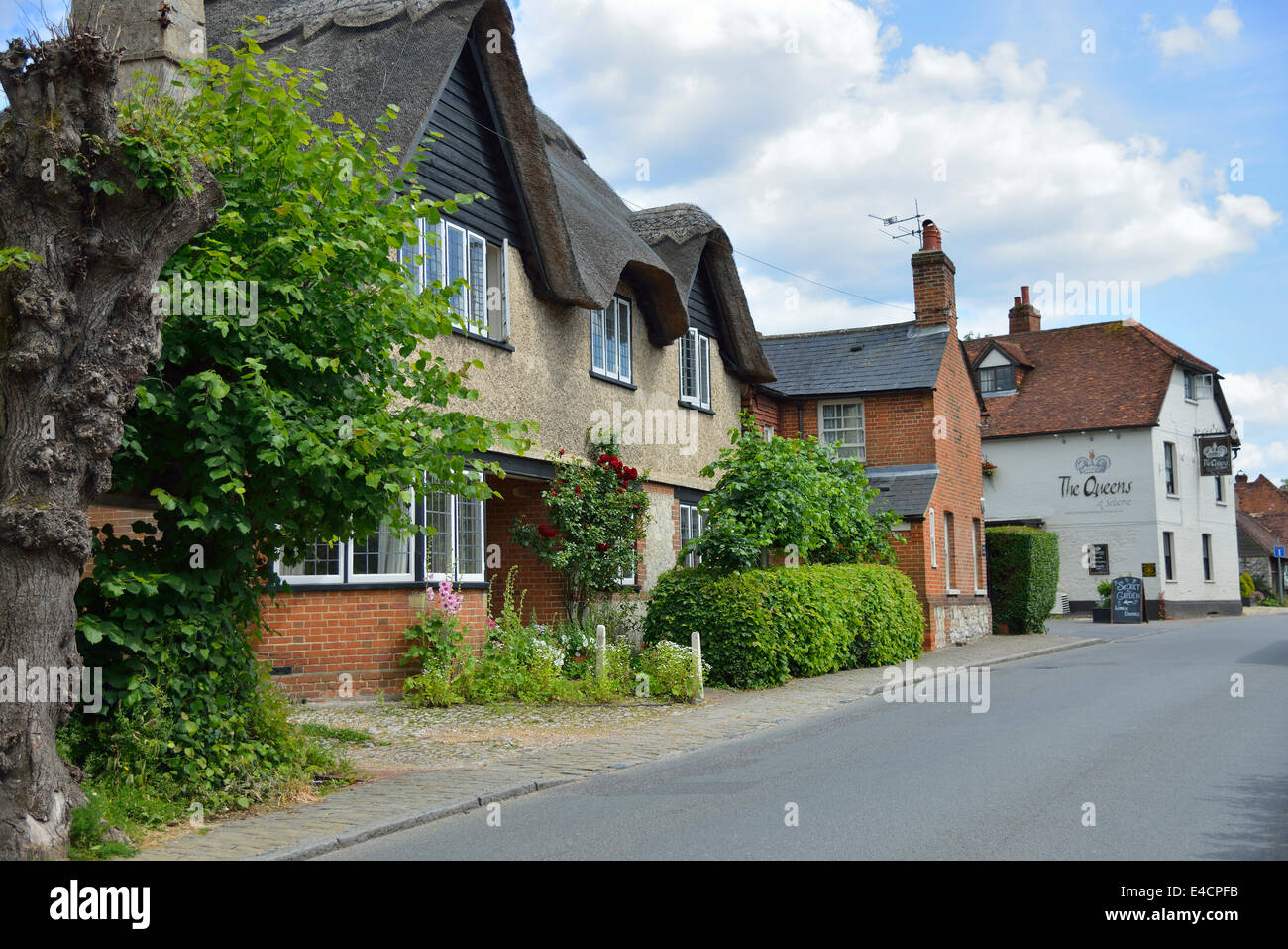 Country cottages and The Queens public house on the high street in the ...