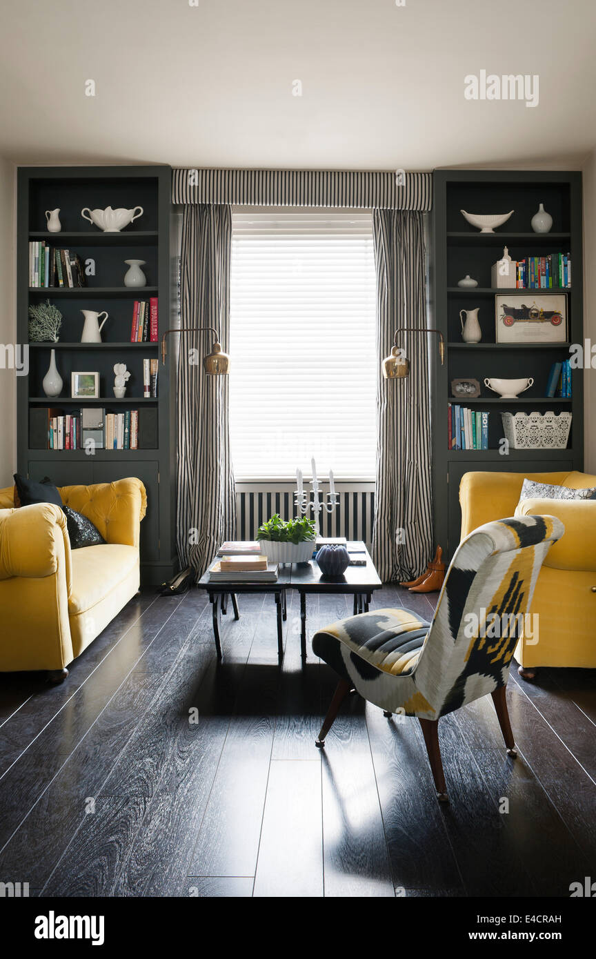 Victorian buttoned sofas upholstered in Romo Lucien yellow velvet in ...