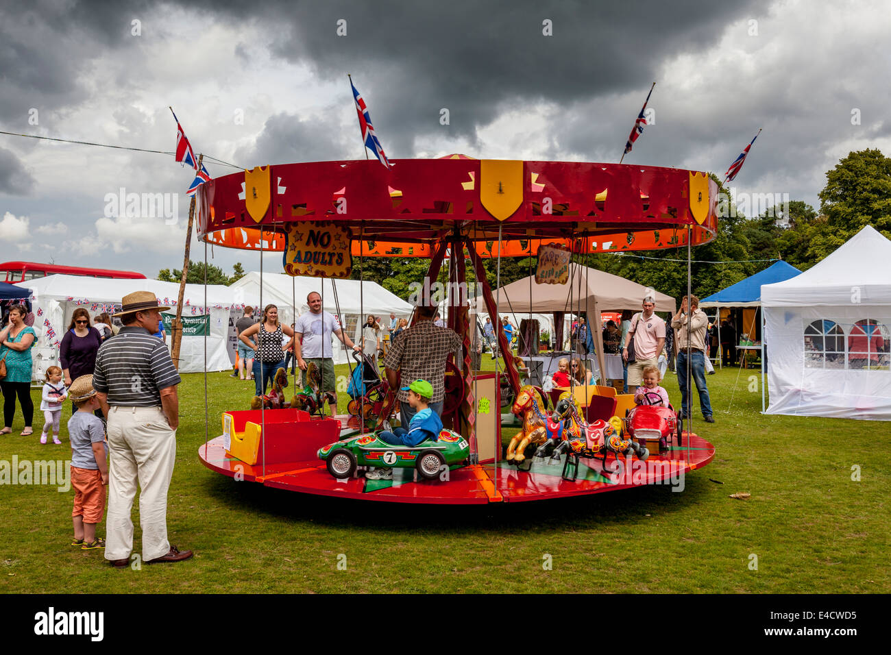 A Traditional Merry Go Round, Nutley Fete, Sussex, England Stock Photo ...