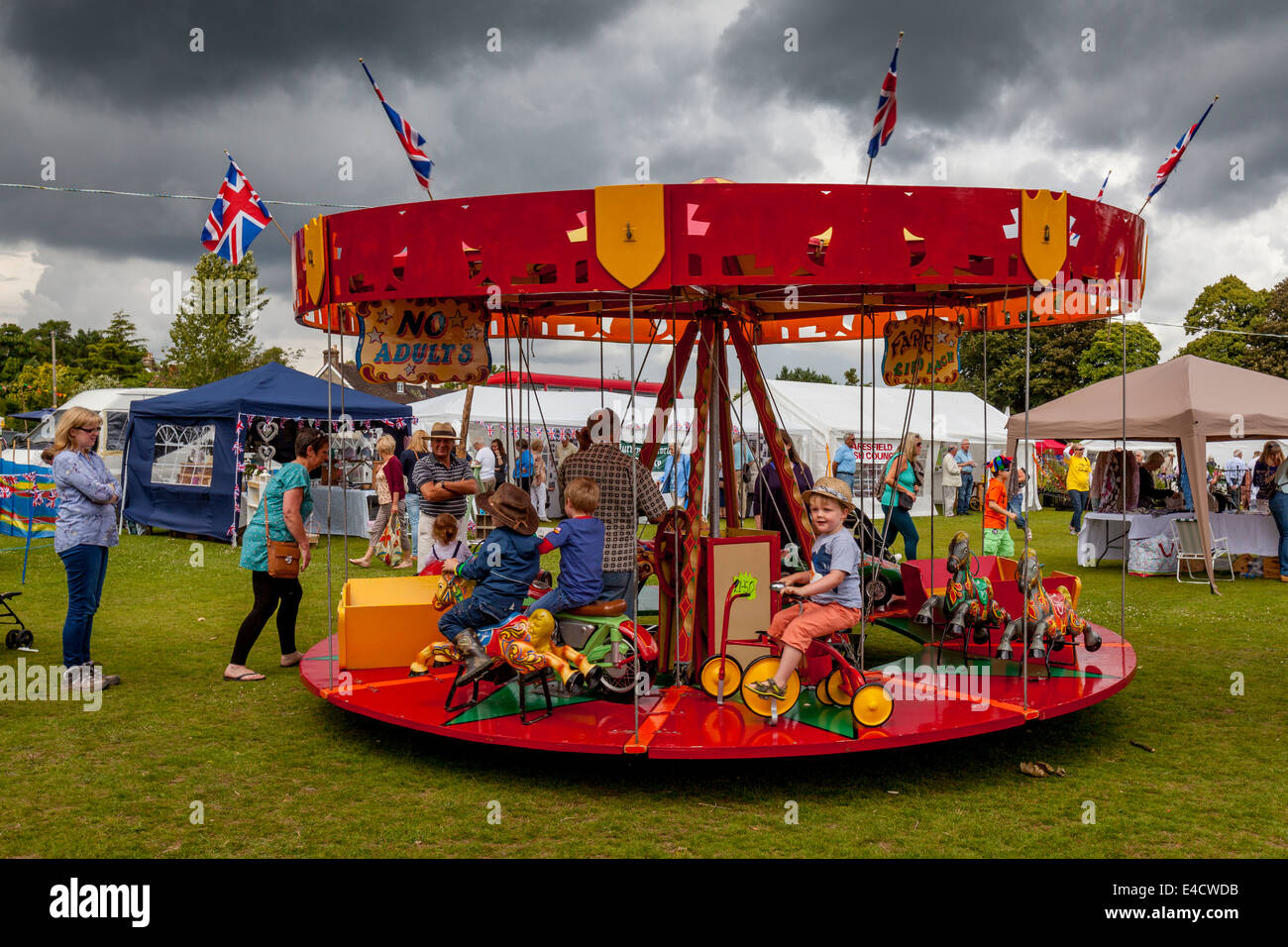 A Traditional Merry Go Round, Nutley Fete, Sussex, England Stock Photo ...