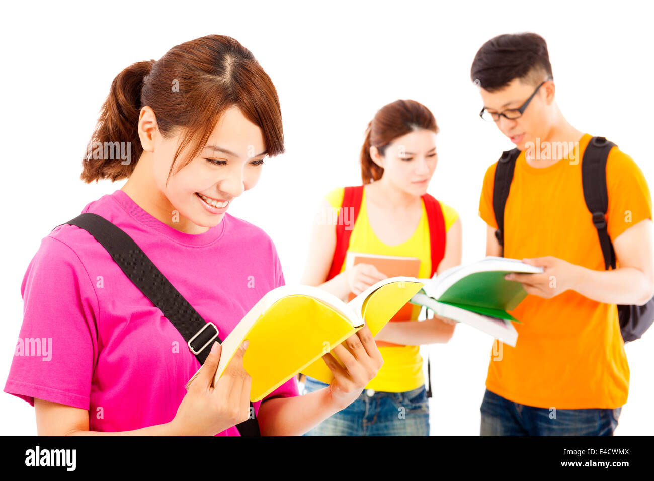 young student read a book with classmates Stock Photo - Alamy