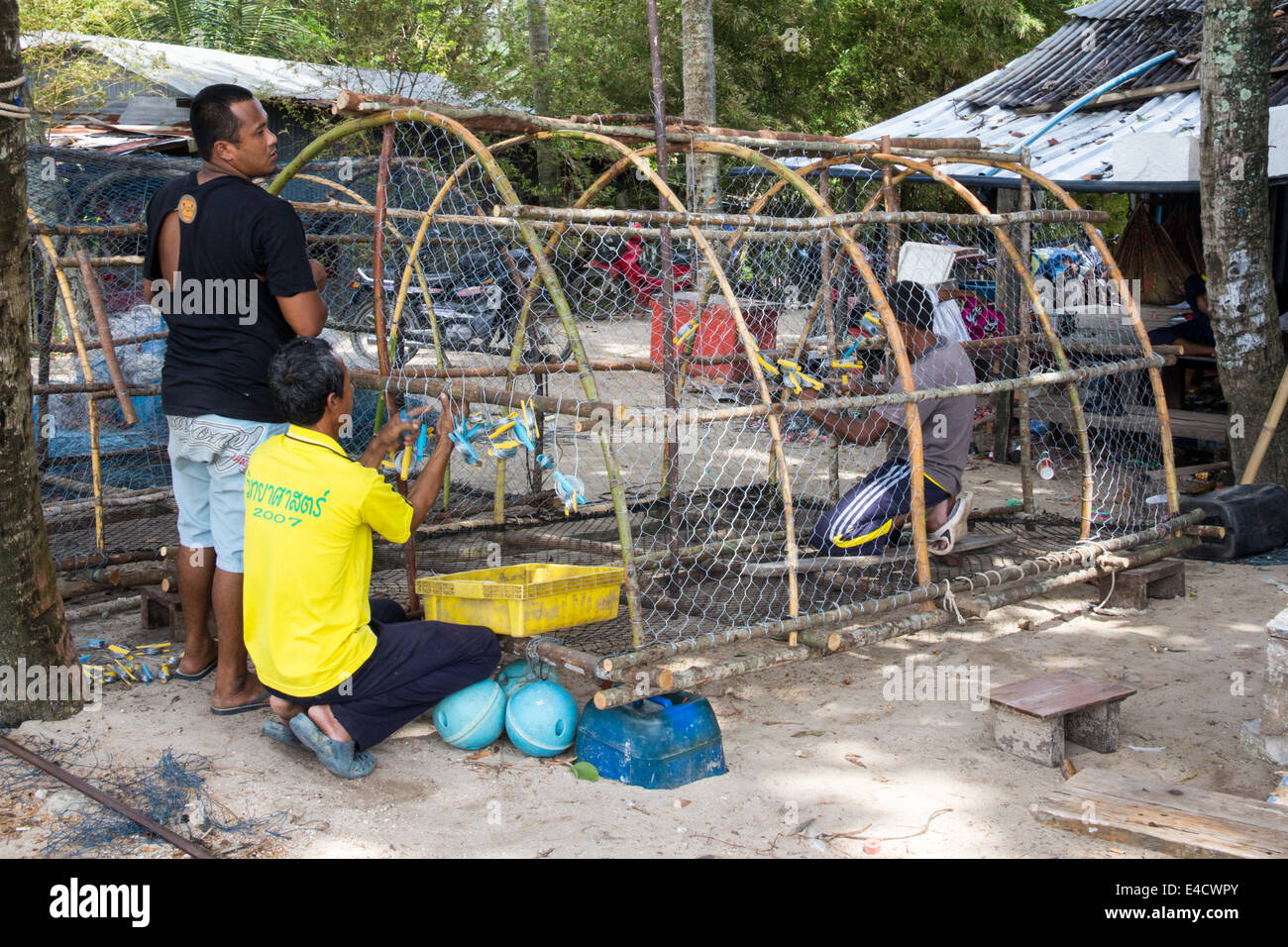 Phuke, Thailand-July 18th 2013: Fishermen making a fish trap at Bang Ta ...