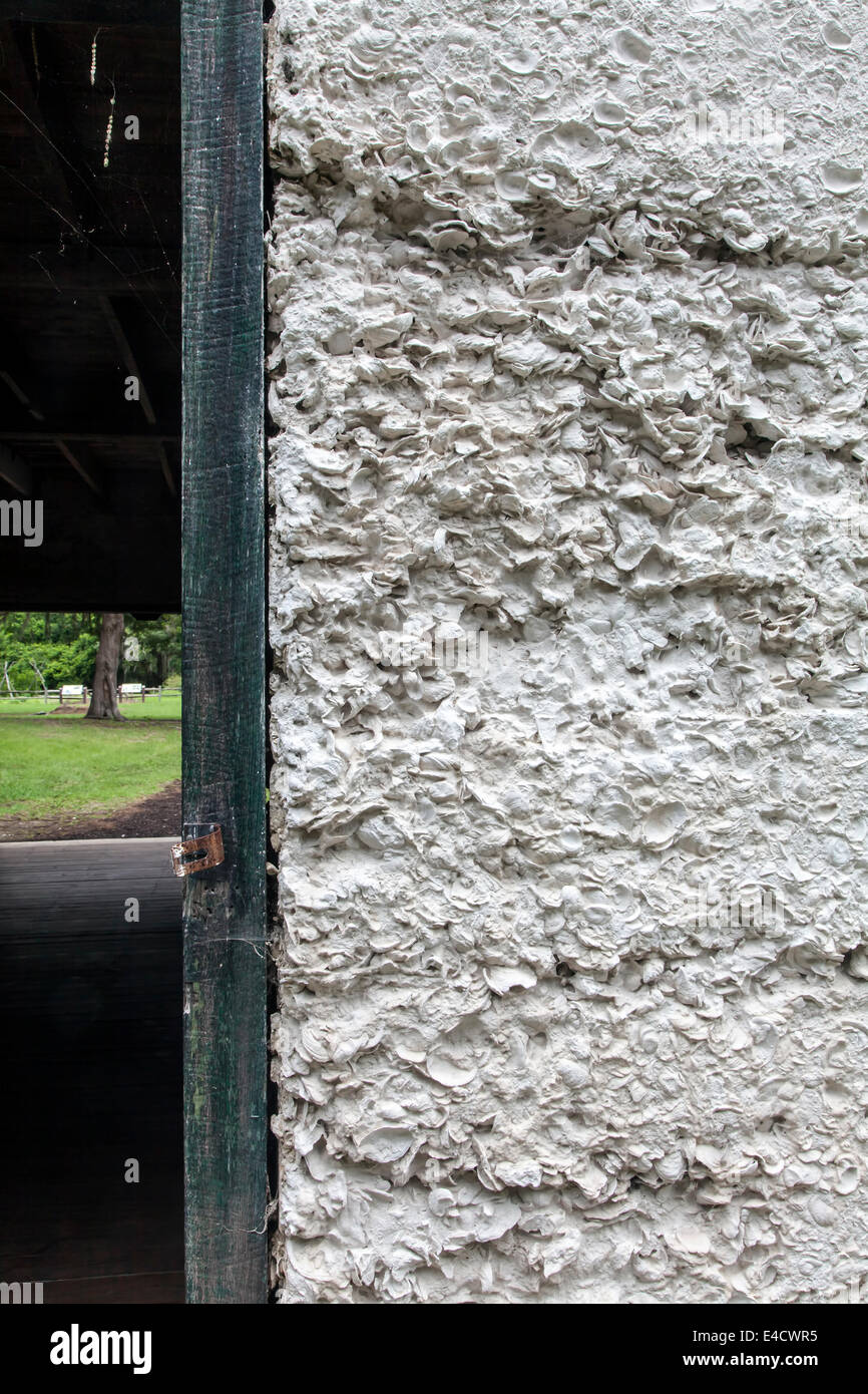 Door frame in tabby concrete wall of the old barn on the historic ...