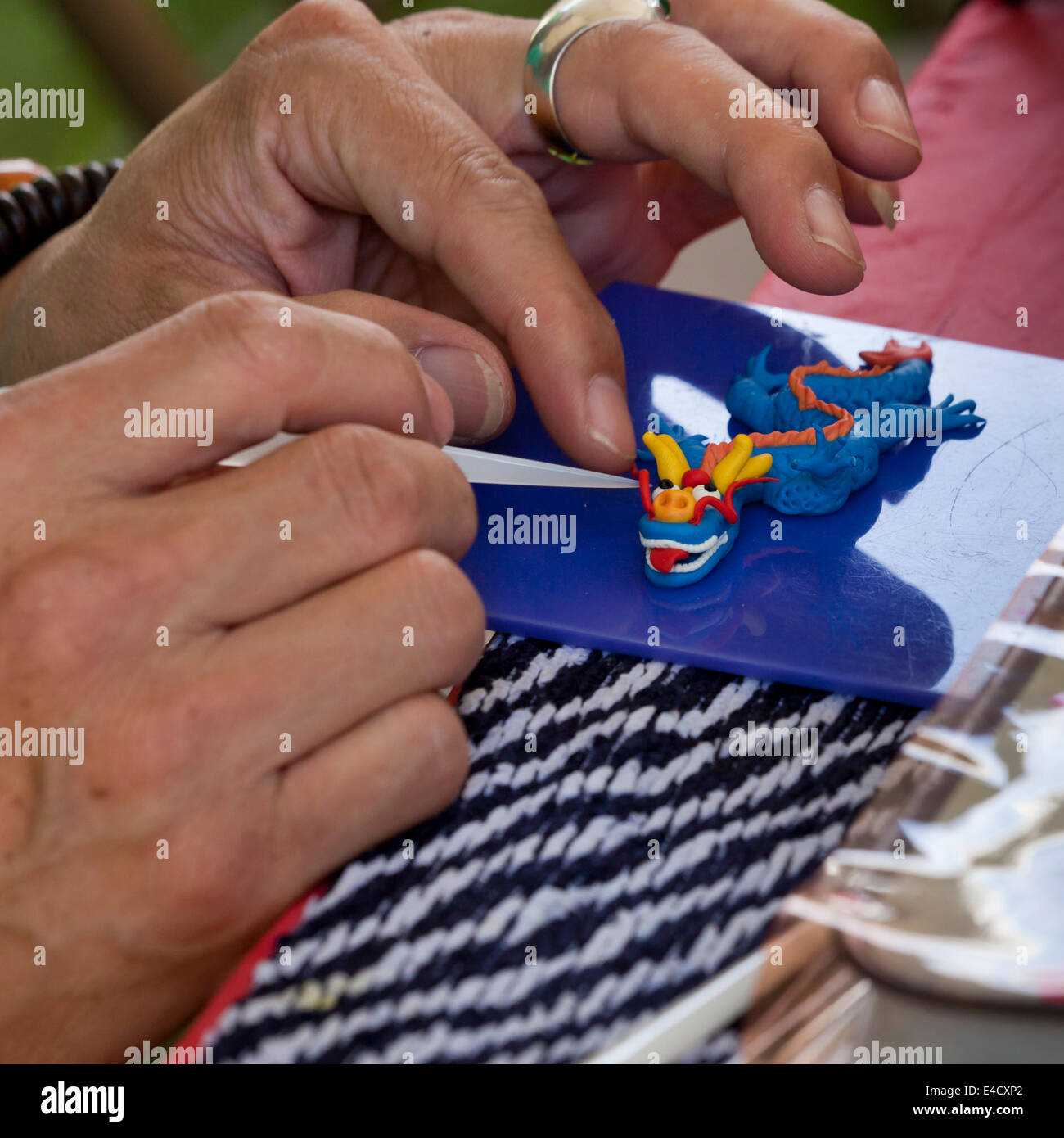 Man making dough model of Chinese zodiac dragon Stock Photo - Alamy