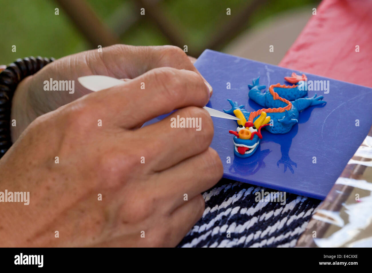 Man making dough model of Chinese zodiac dragon Stock Photo - Alamy