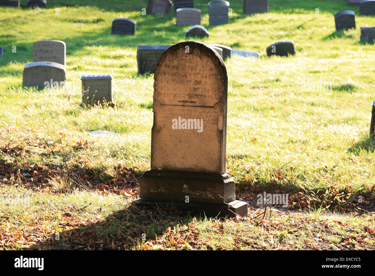 Cemetery gravestone during the fall season Stock Photo - Alamy