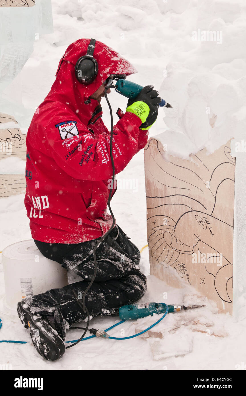 Ice carver at the Lake Louise Ice Sculpting Festival, Lake Louise ...
