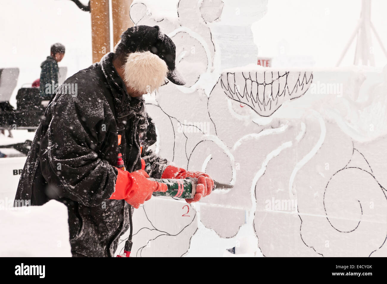 Ice carver at the Lake Louise Ice Sculpting Festival, Lake Louise ...