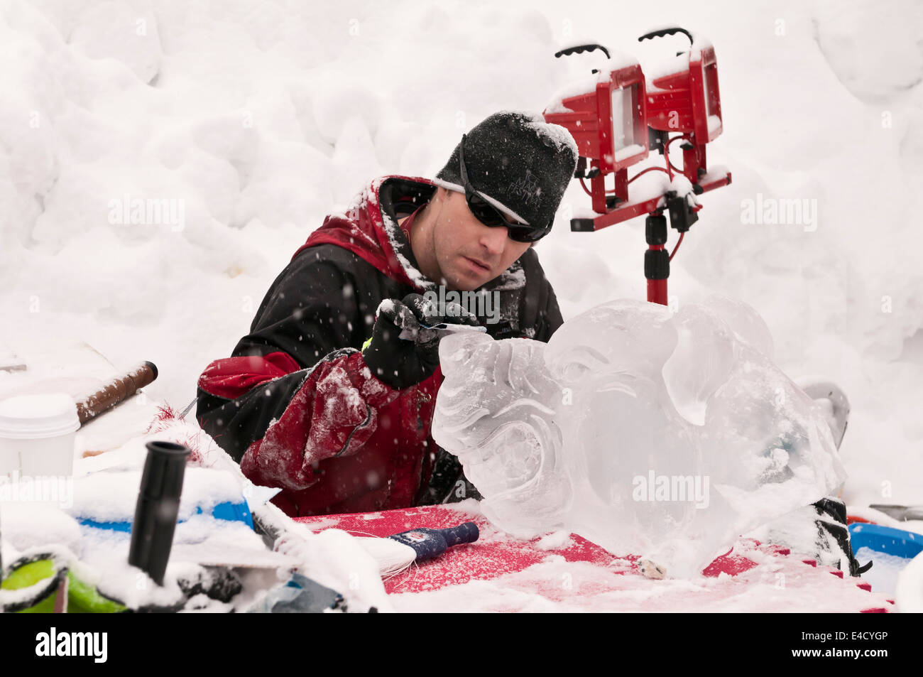 Ice carver at the Lake Louise Ice Sculpting Festival, Lake Louise ...