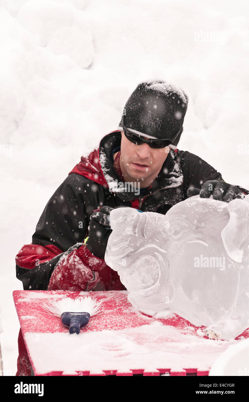 Ice carver at the Lake Louise Ice Sculpting Festival, Lake Louise ...