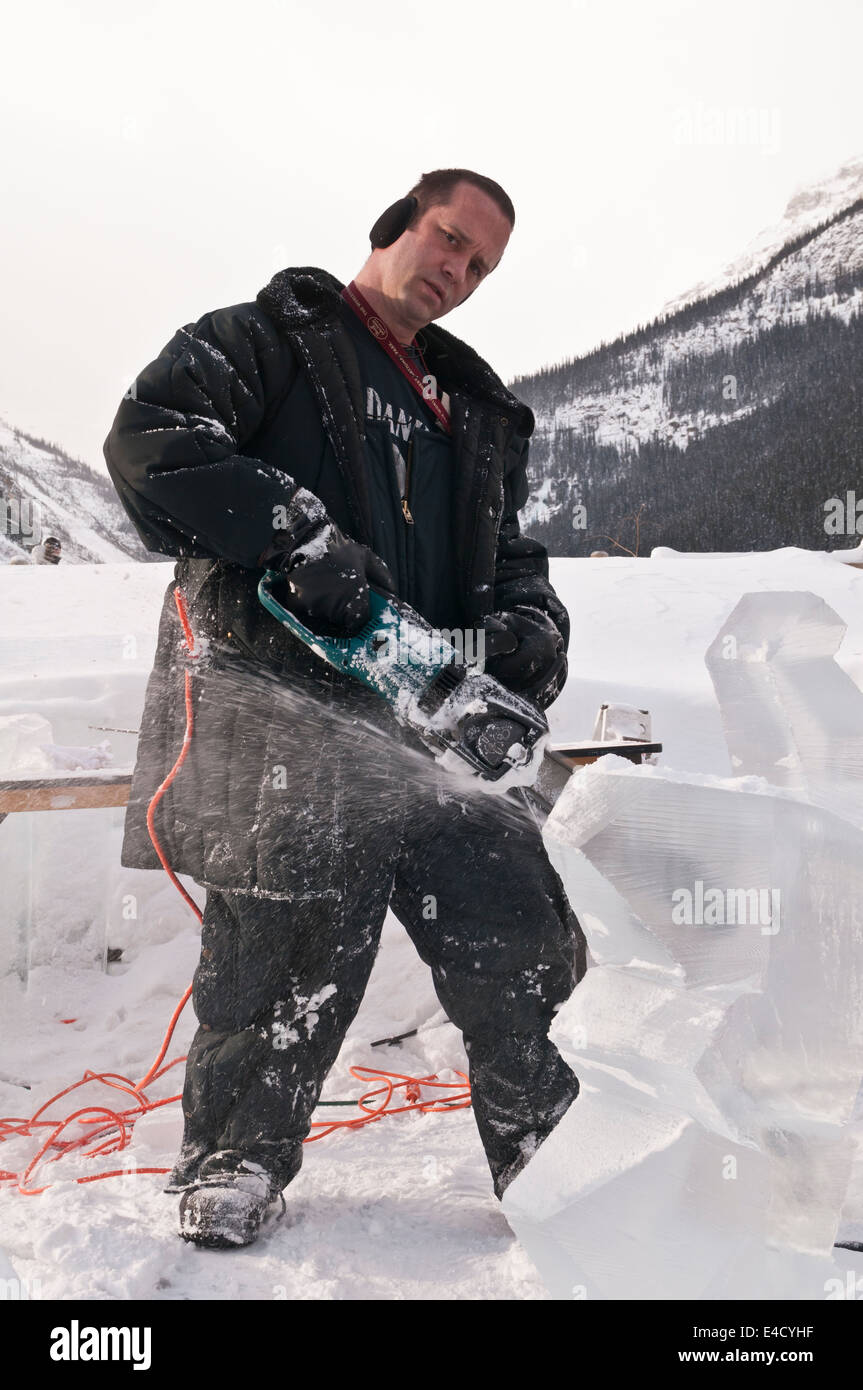 Ice carver at the Lake Louise Ice Sculpting Festival, Lake Louise ...