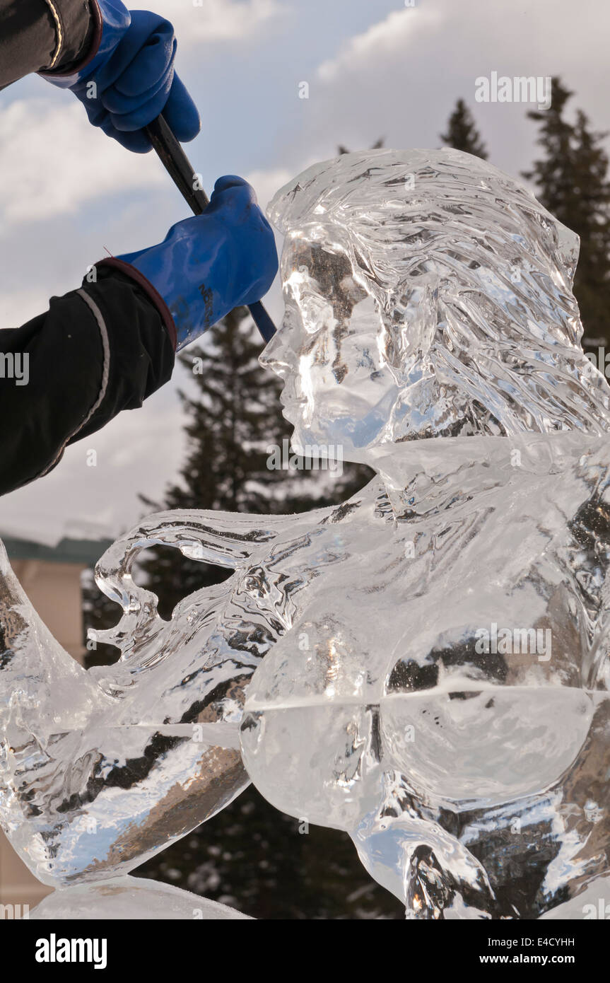 Ice carver at the Lake Louise Ice Sculpting Festival, Lake Louise ...